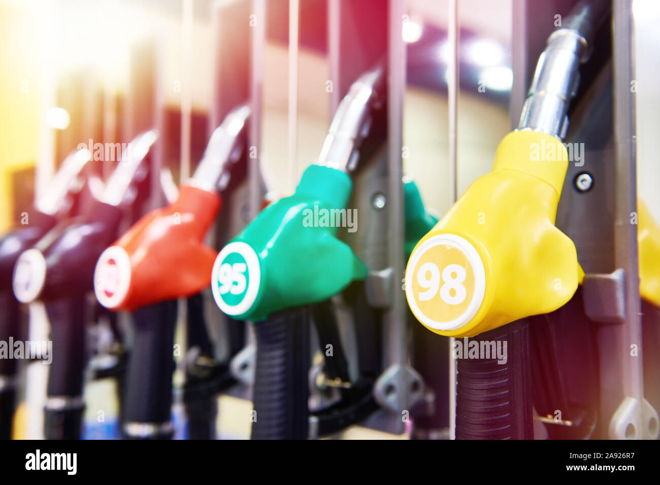Fuel nozzles on filling station closeup Stock Photo - Alamy