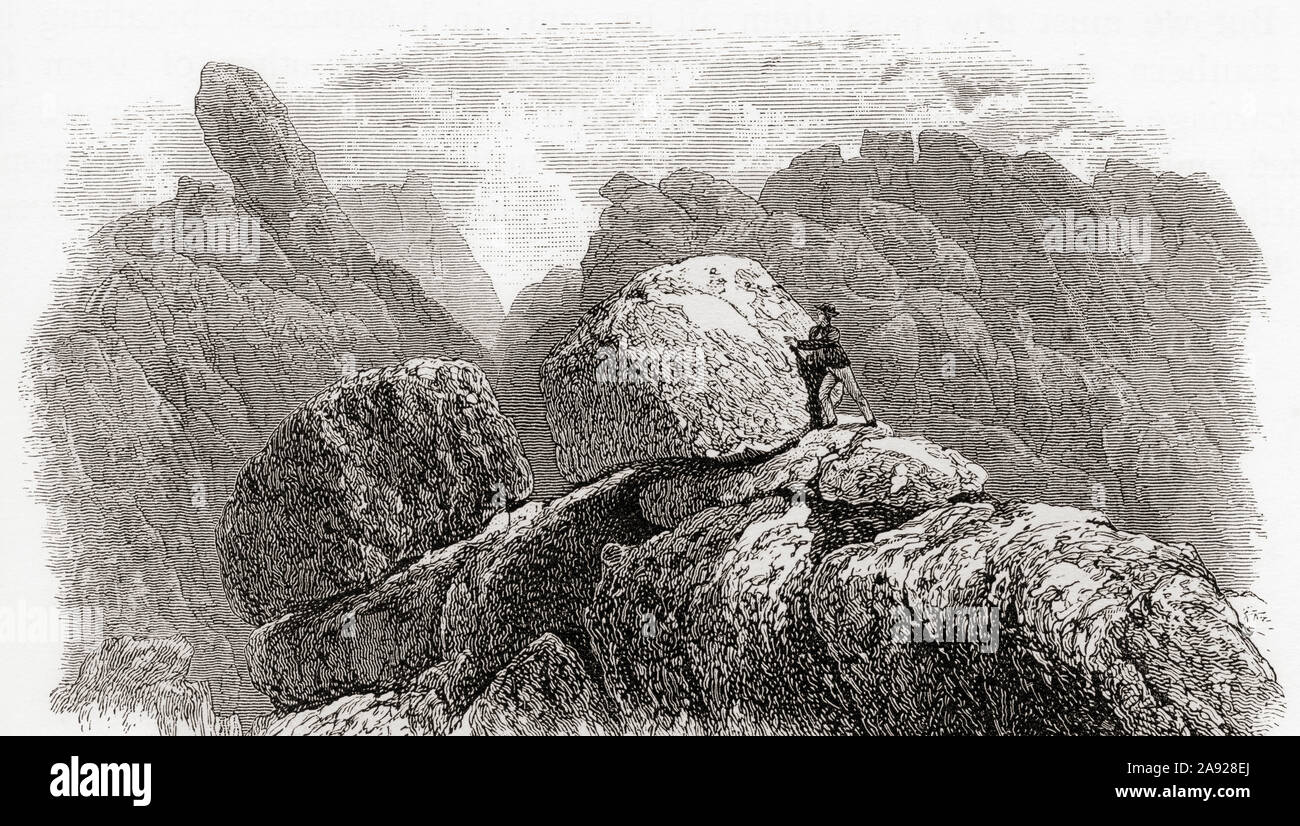 The Logan Rock, near the village of Treen, Cornwall, England, seen here ...