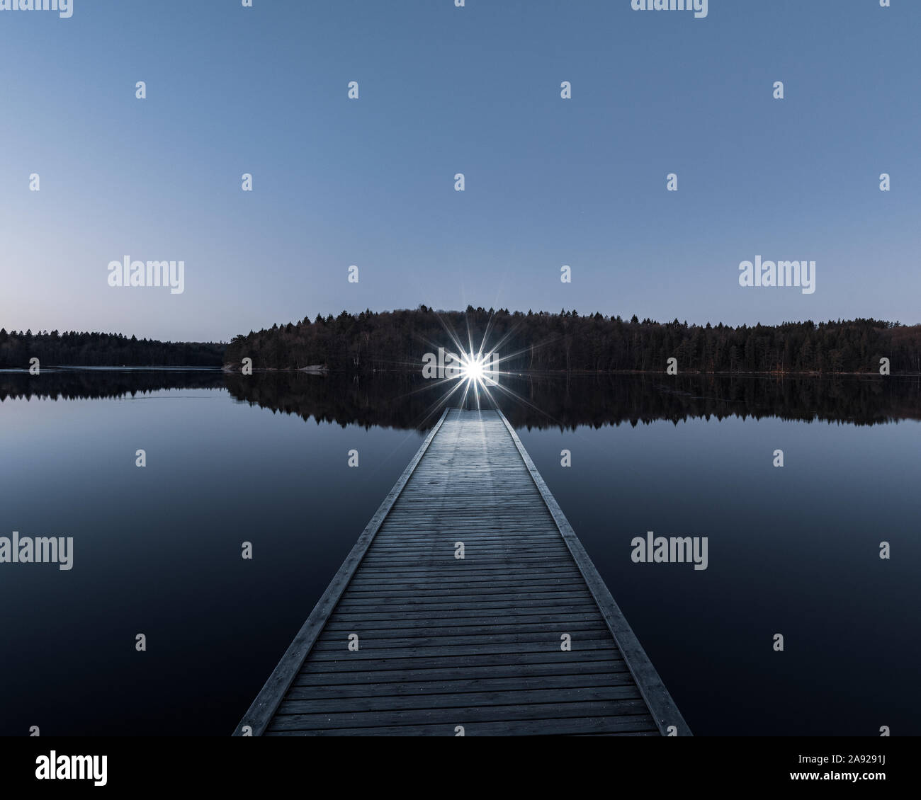 Light at the end of jetty Stock Photo - Alamy