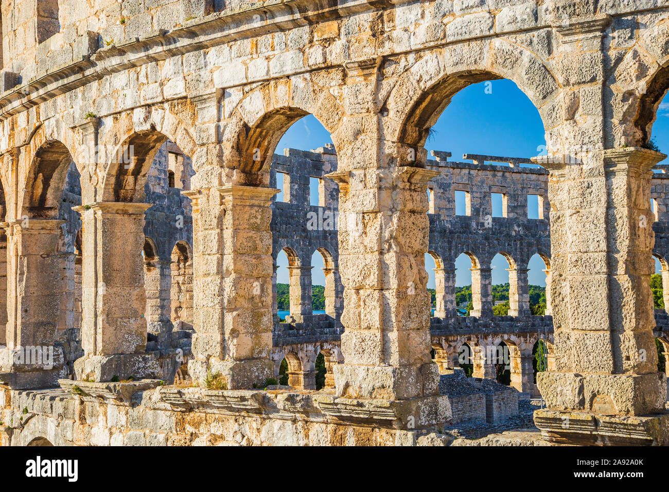 Big stone arches of monumental ancient Roman arena in Pula, Istria ...