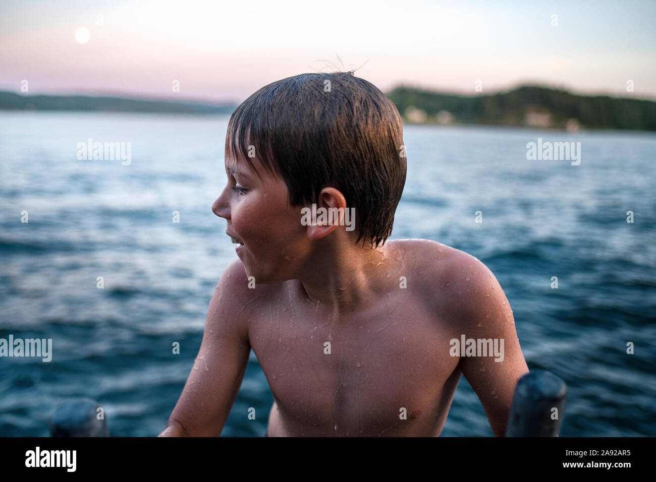 Boy at sea Stock Photo - Alamy