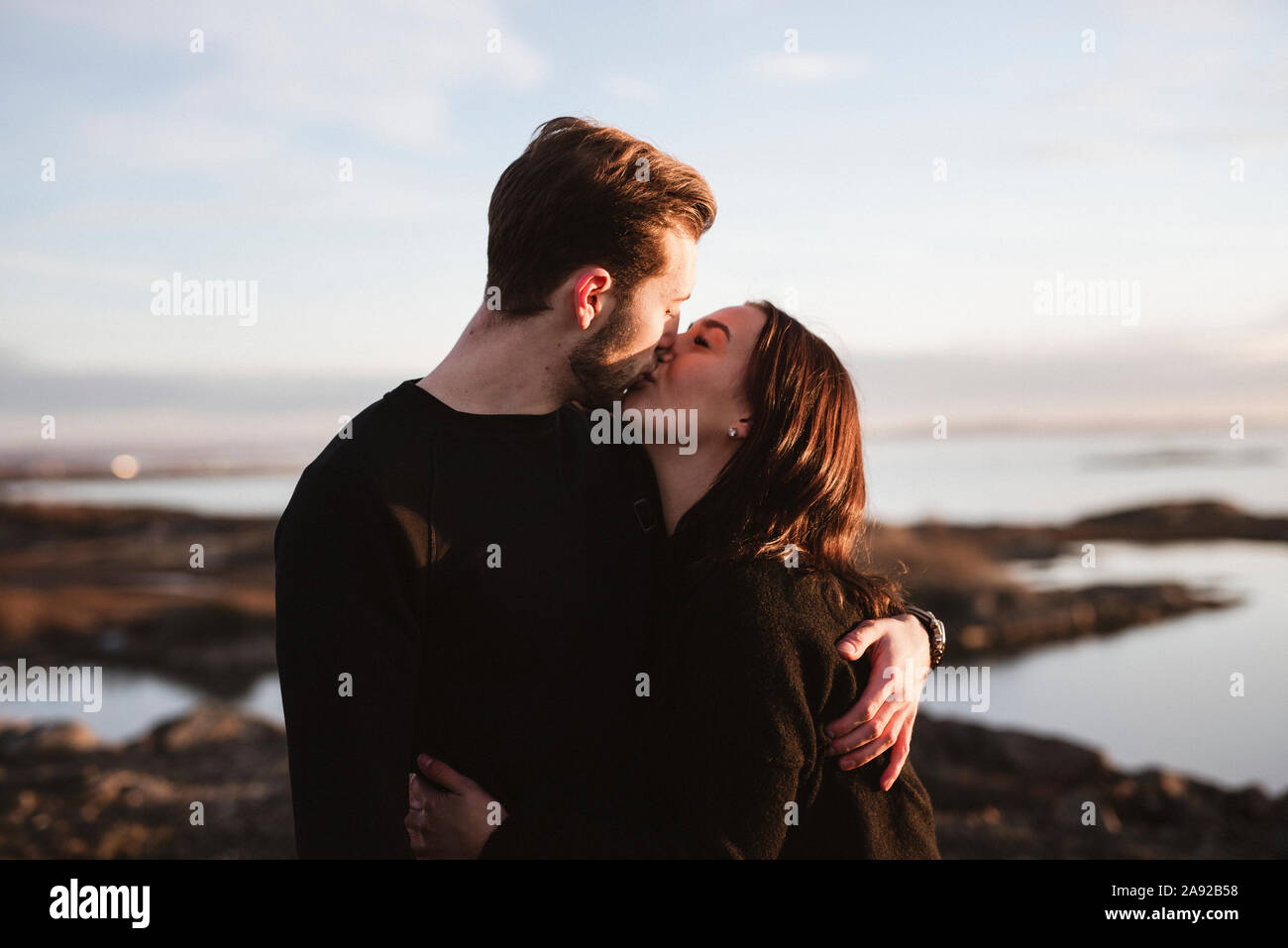 Man with two girls kissing hi-res stock photography and images - Alamy