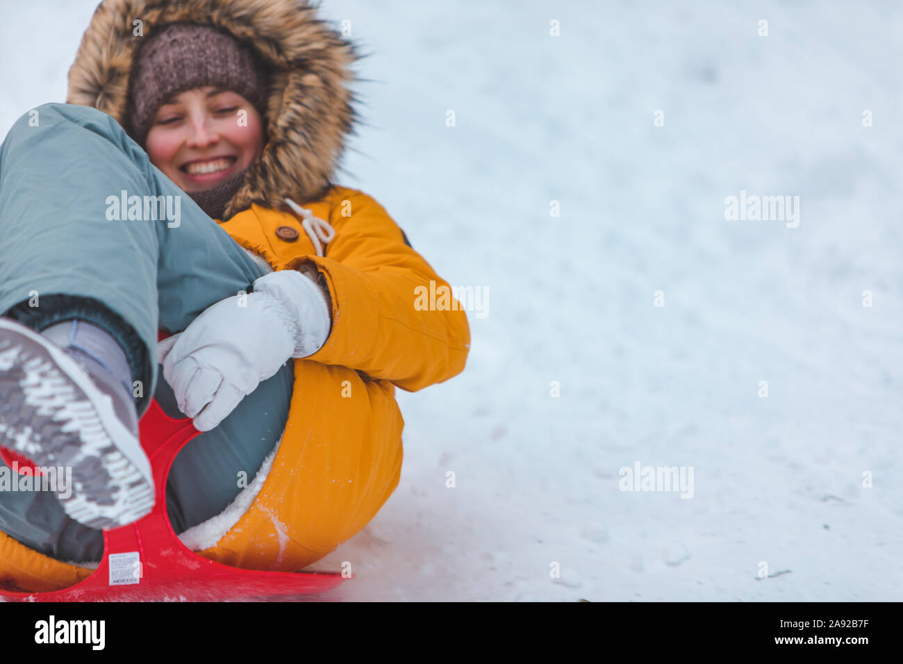 Happy woman sliding down hi-res stock photography and images - Alamy