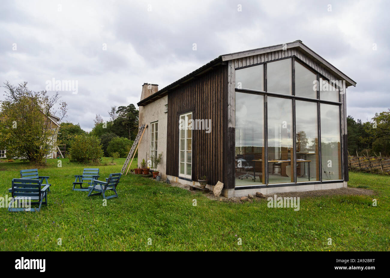 Wooden house with glass wall Stock Photo - Alamy