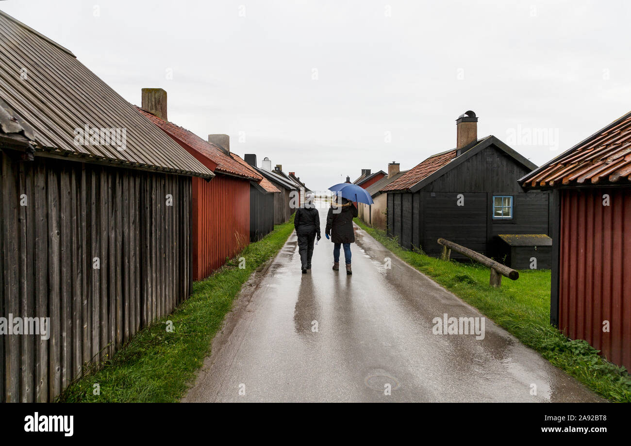 People walking through village Stock Photo - Alamy