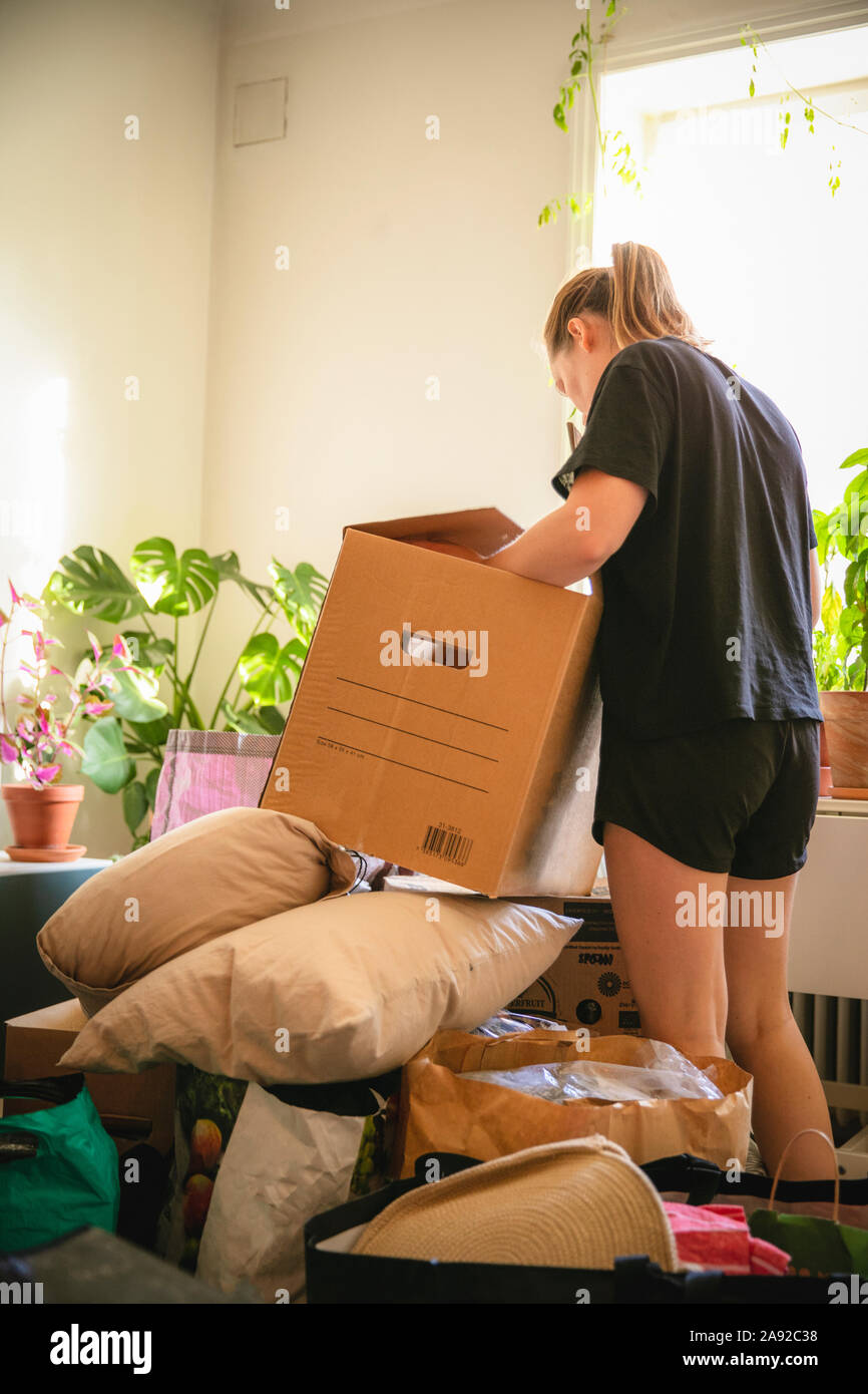 Woman holding box Stock Photo - Alamy