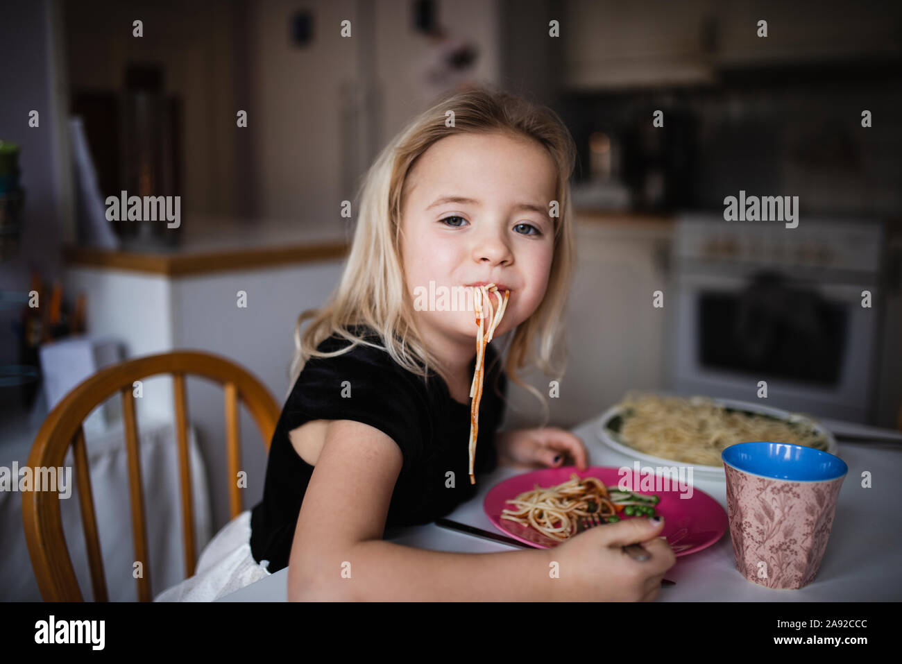 Smiling sitting eating food and drink hi-res stock photography and ...