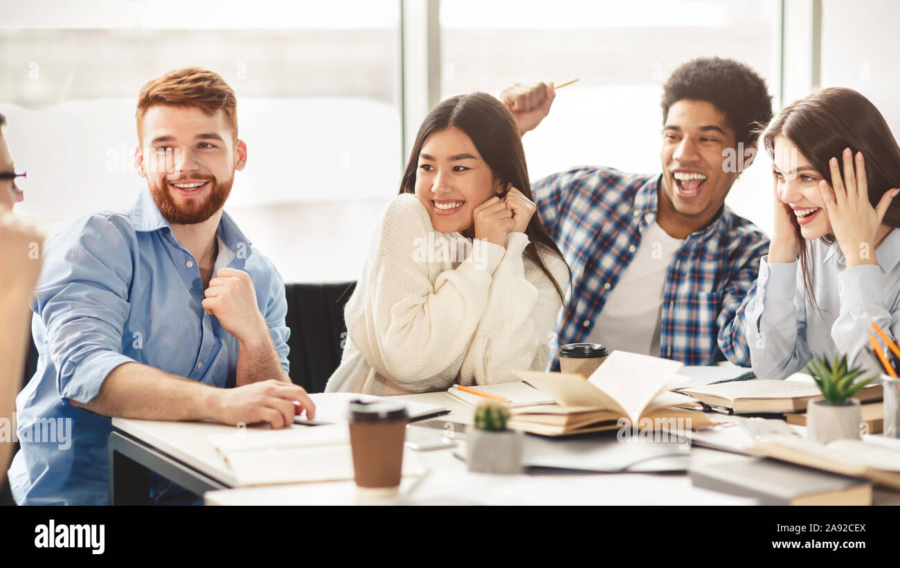 University lifestyle. Happy students talking in college library Stock ...