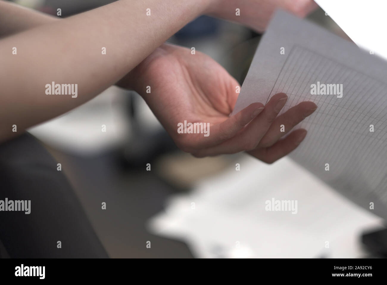 Woman two sheets of paper hi-res stock photography and images - Alamy