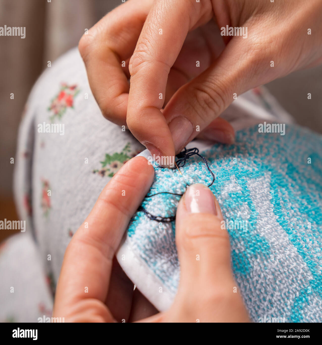 Woman sews up clothes. Hands seamstress close-up. Mending clothes Stock ...