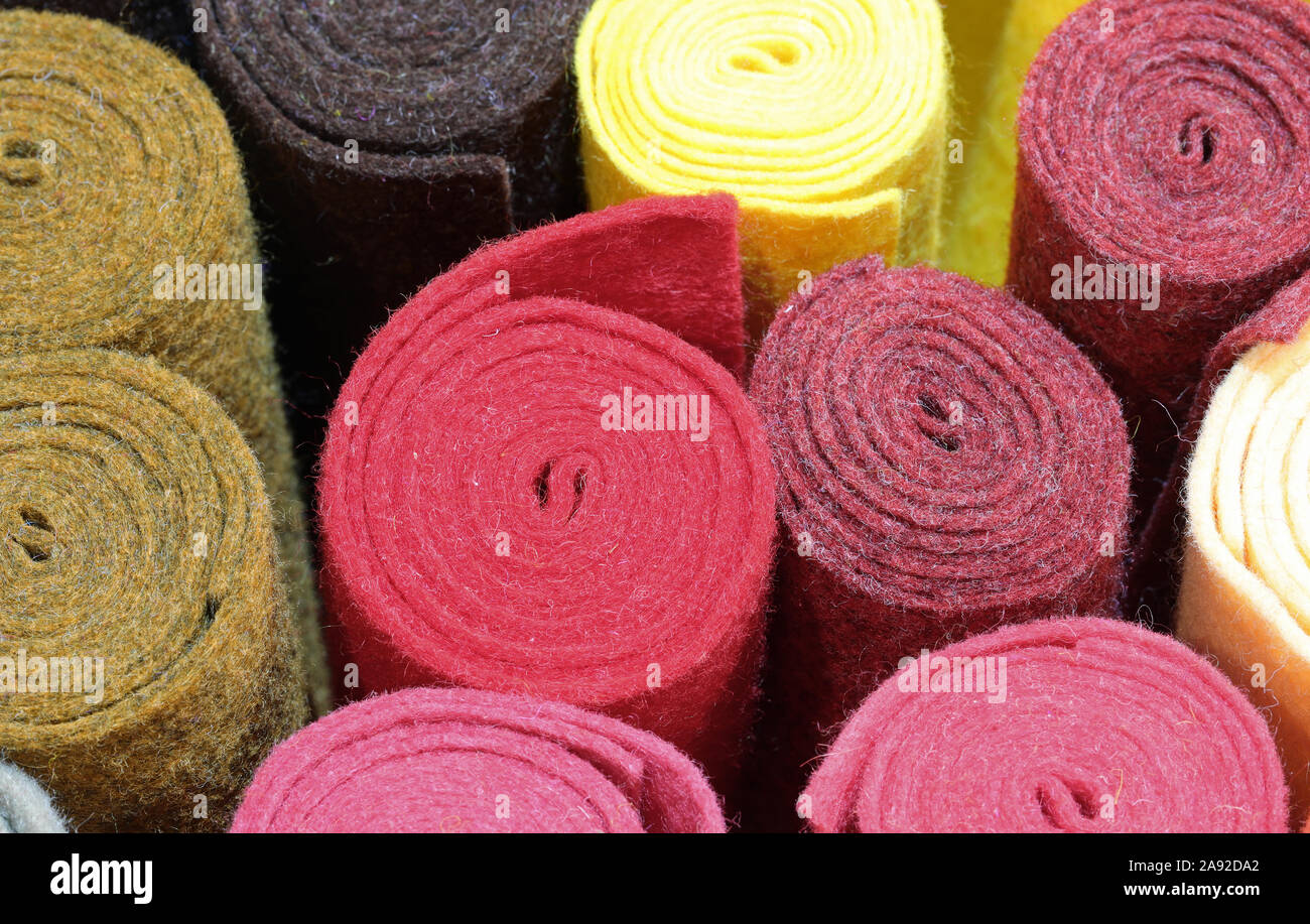 red roll and more rolls of fabrics for sale Stock Photo - Alamy