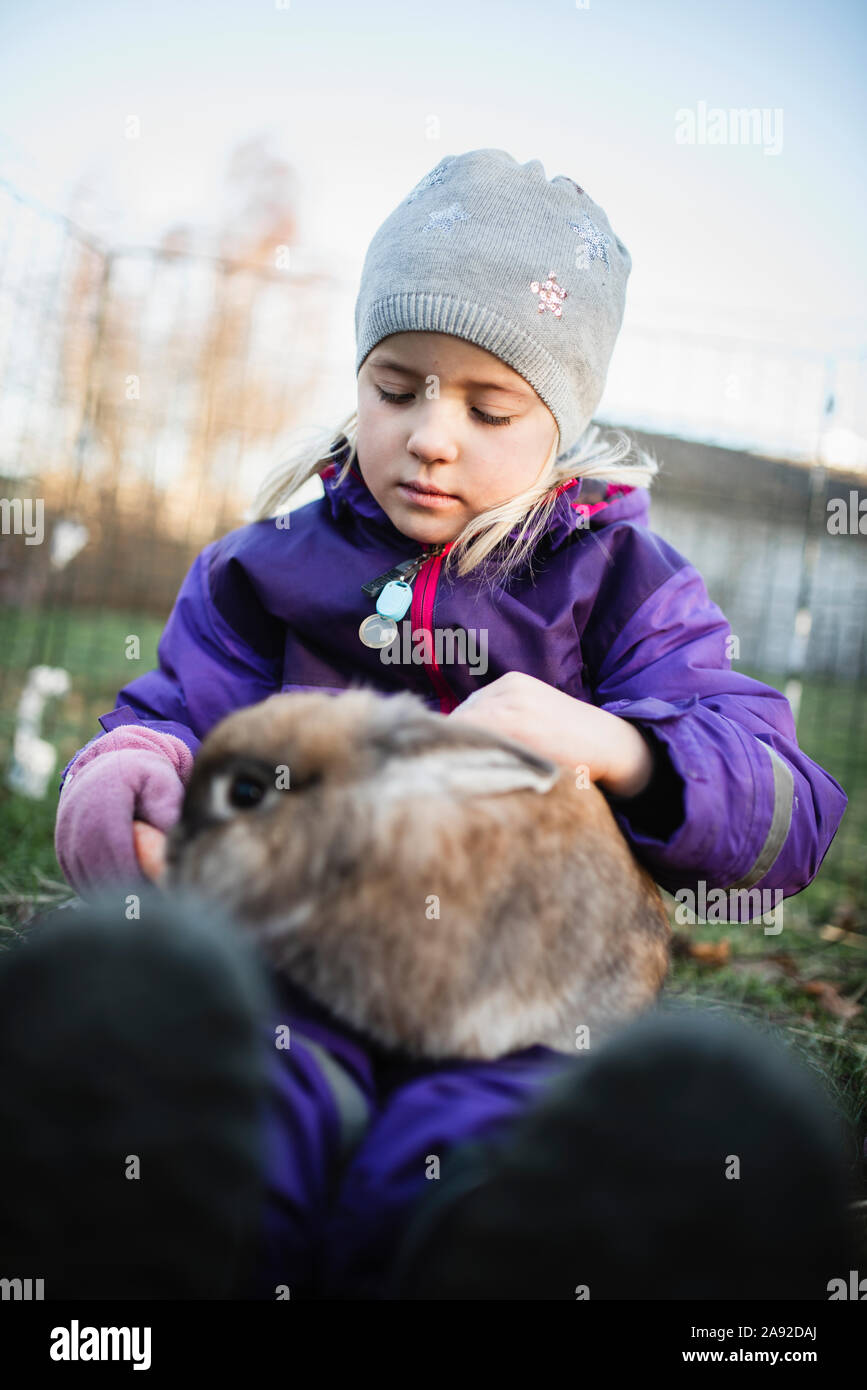 Girl with rabbit Stock Photo - Alamy