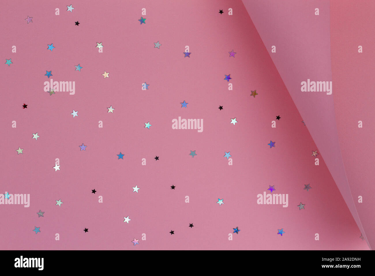 Pastel pink paper in geometric shape with glitter stars. Abstract ...