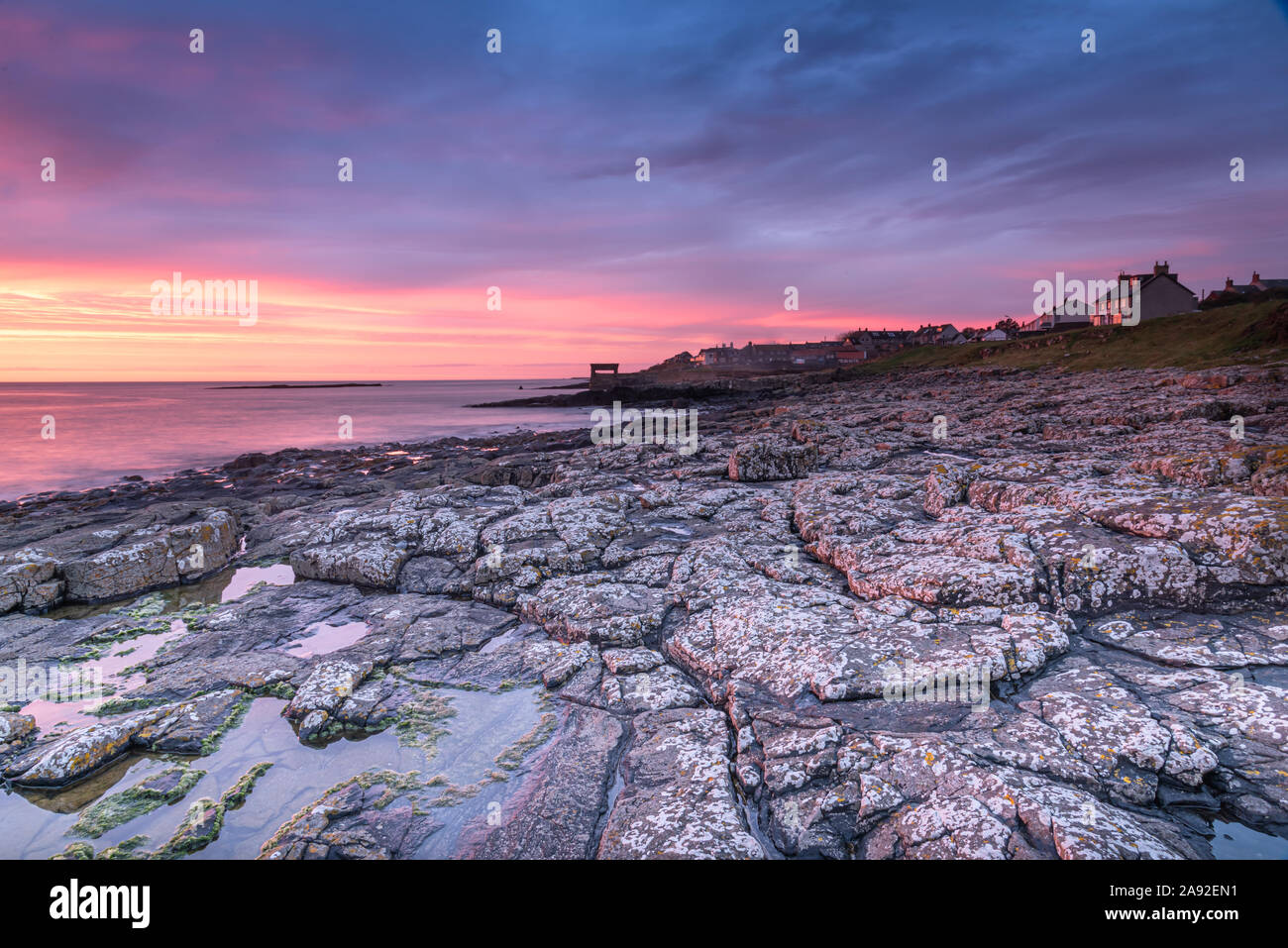 Sunrise at Craster on the Northumberland coast Stock Photo - Alamy