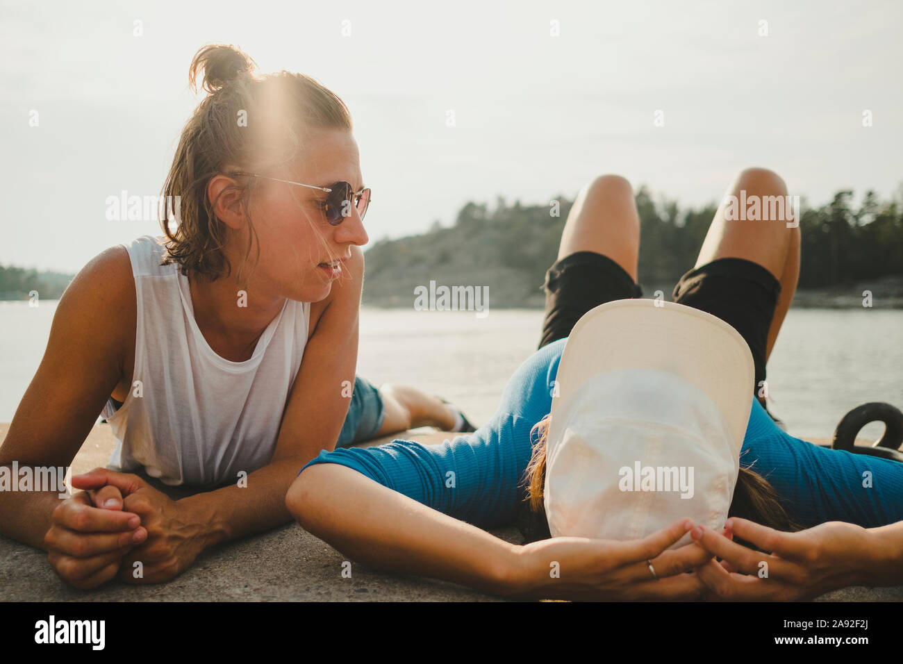 Friends relaxing at sea Stock Photo - Alamy