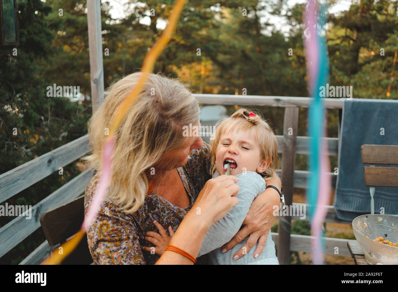 Mother brushing daughters teeth Stock Photo - Alamy