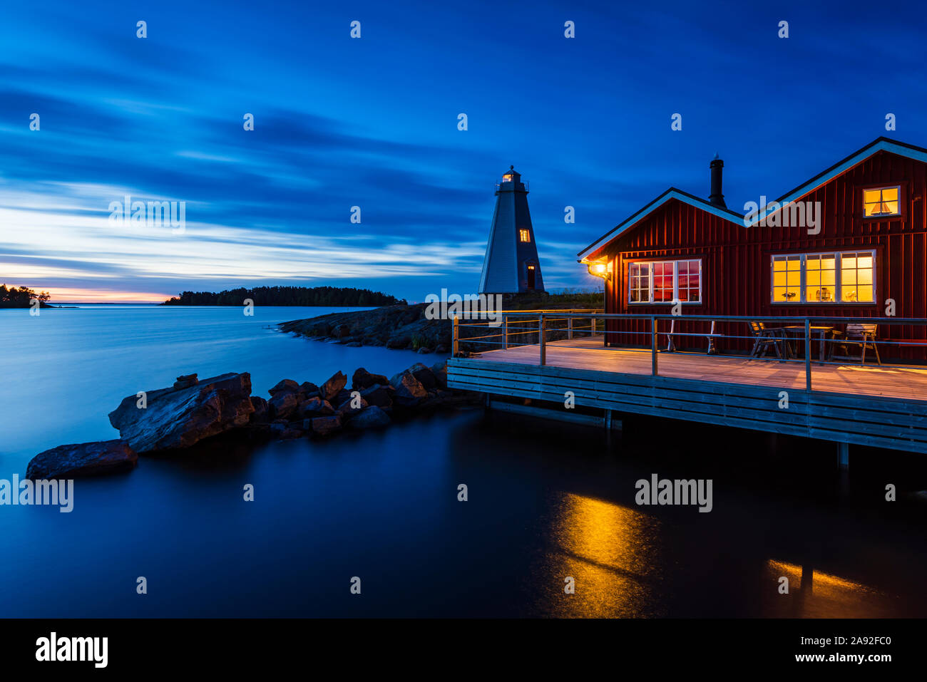 Lighthouse at dusk Stock Photo - Alamy