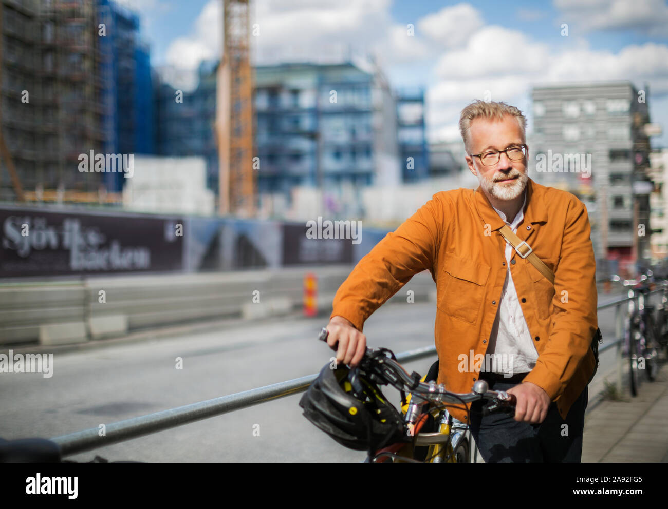 Man with bicycle Stock Photo - Alamy