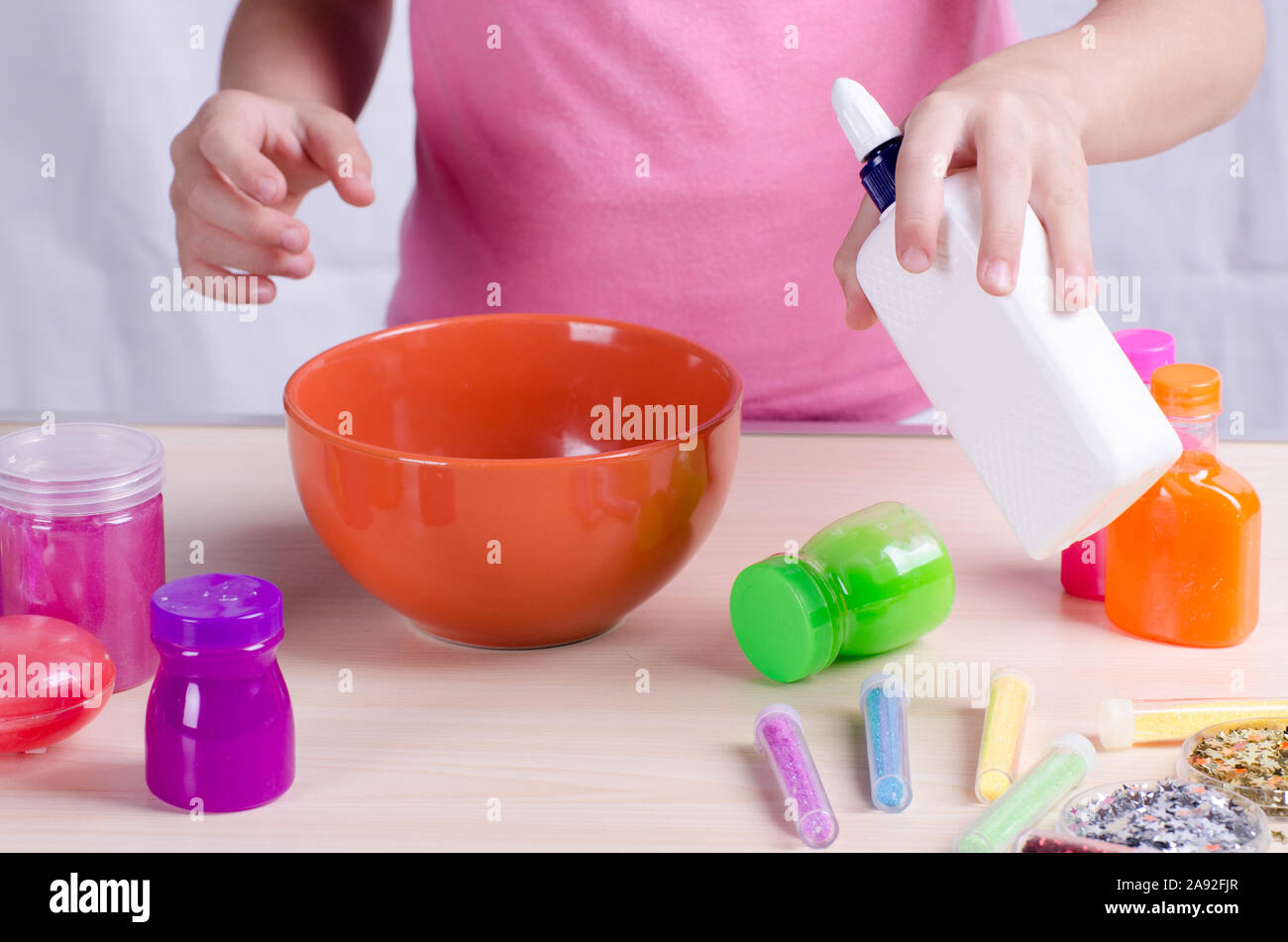 Slime making process. Kid making slime, worldwide popular self made toy ...