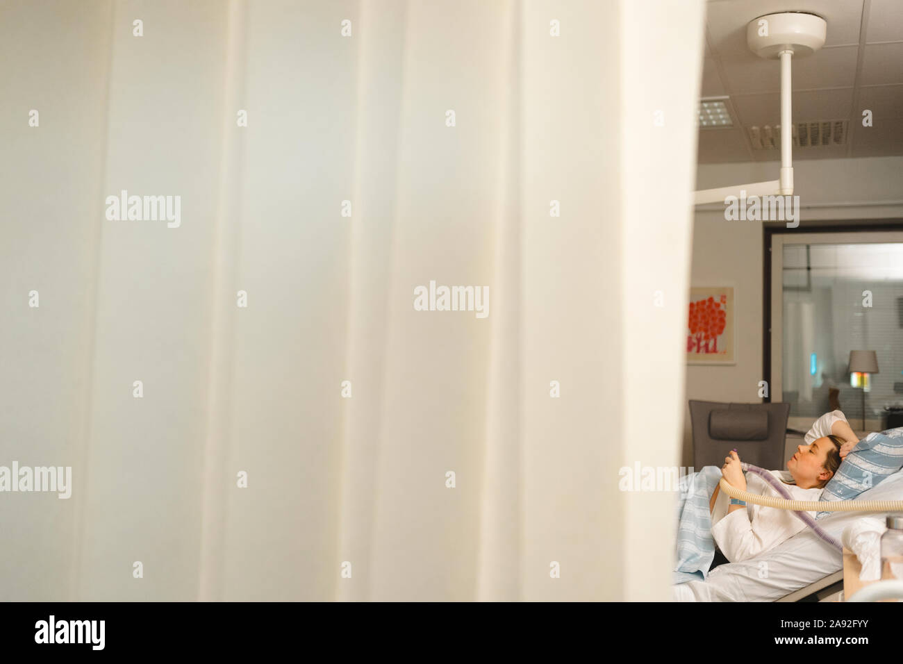 Adult woman lying on hospital hi-res stock photography and images - Alamy