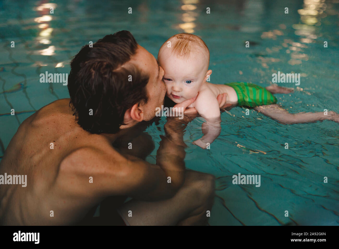 Father with baby in swimming-pool Stock Photo - Alamy