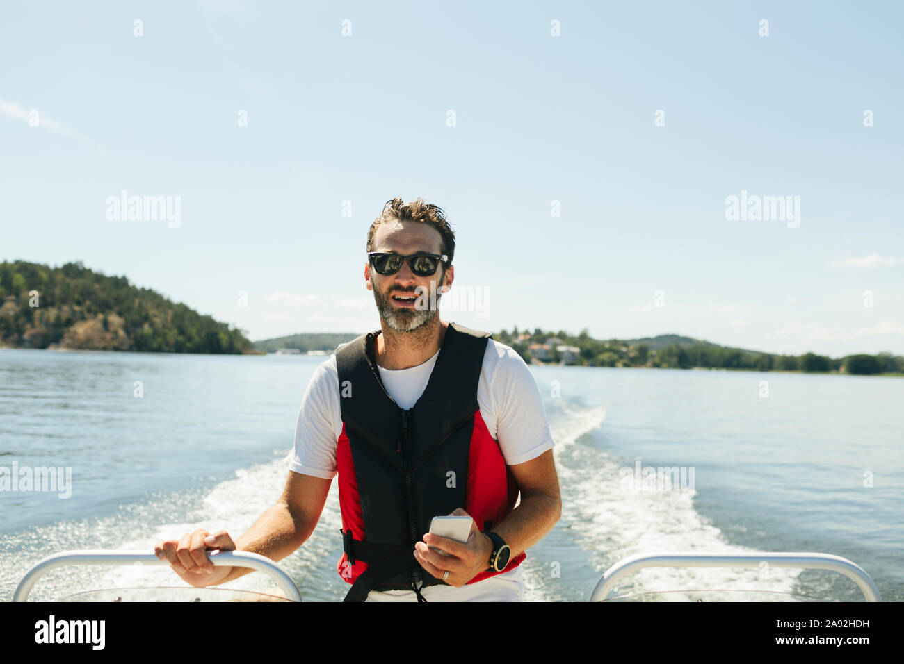 Man on boat Stock Photo - Alamy