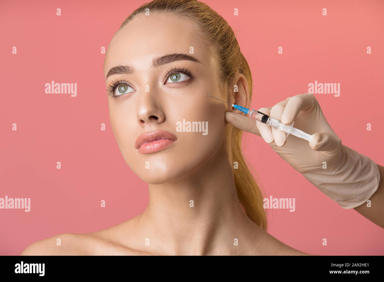 Beauty injection. Beautiful woman making plastic surgery procedure ...