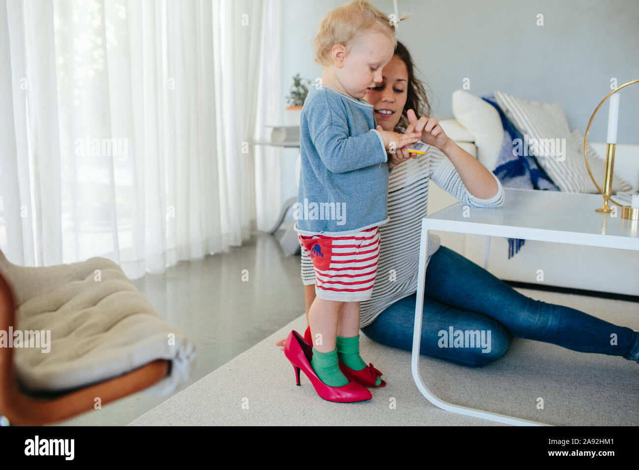 Mother with daughter at home Stock Photo - Alamy