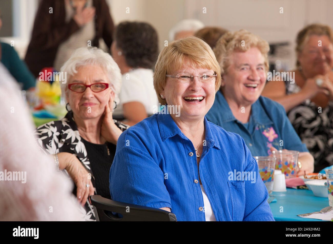 Senior women laughing at a luncheon Stock Photo - Alamy