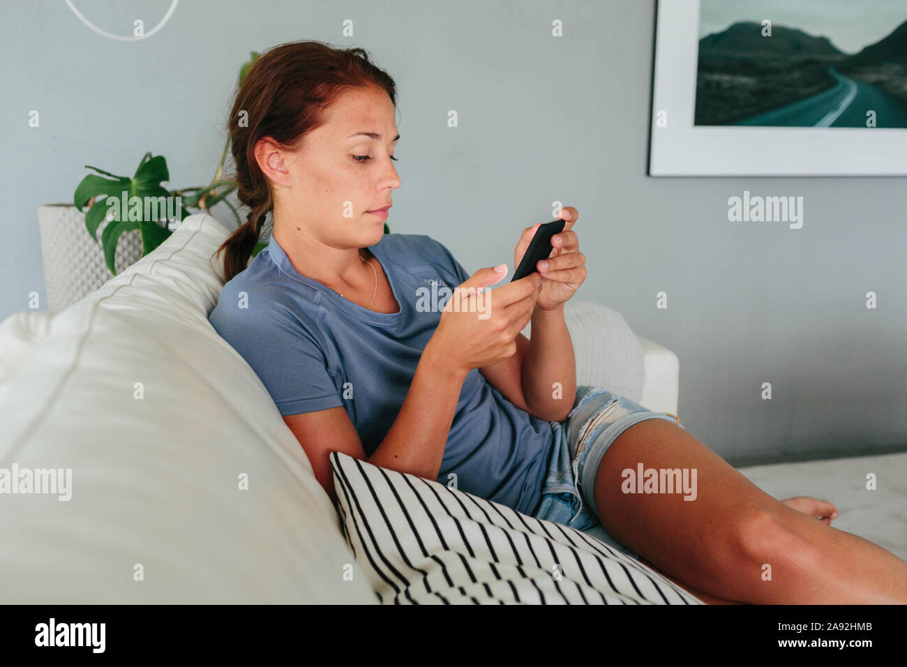 Woman using cell phone Stock Photo - Alamy