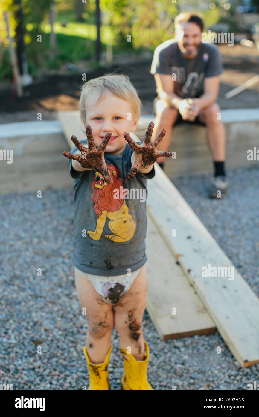 Girl showing dirty hands Stock Photo - Alamy