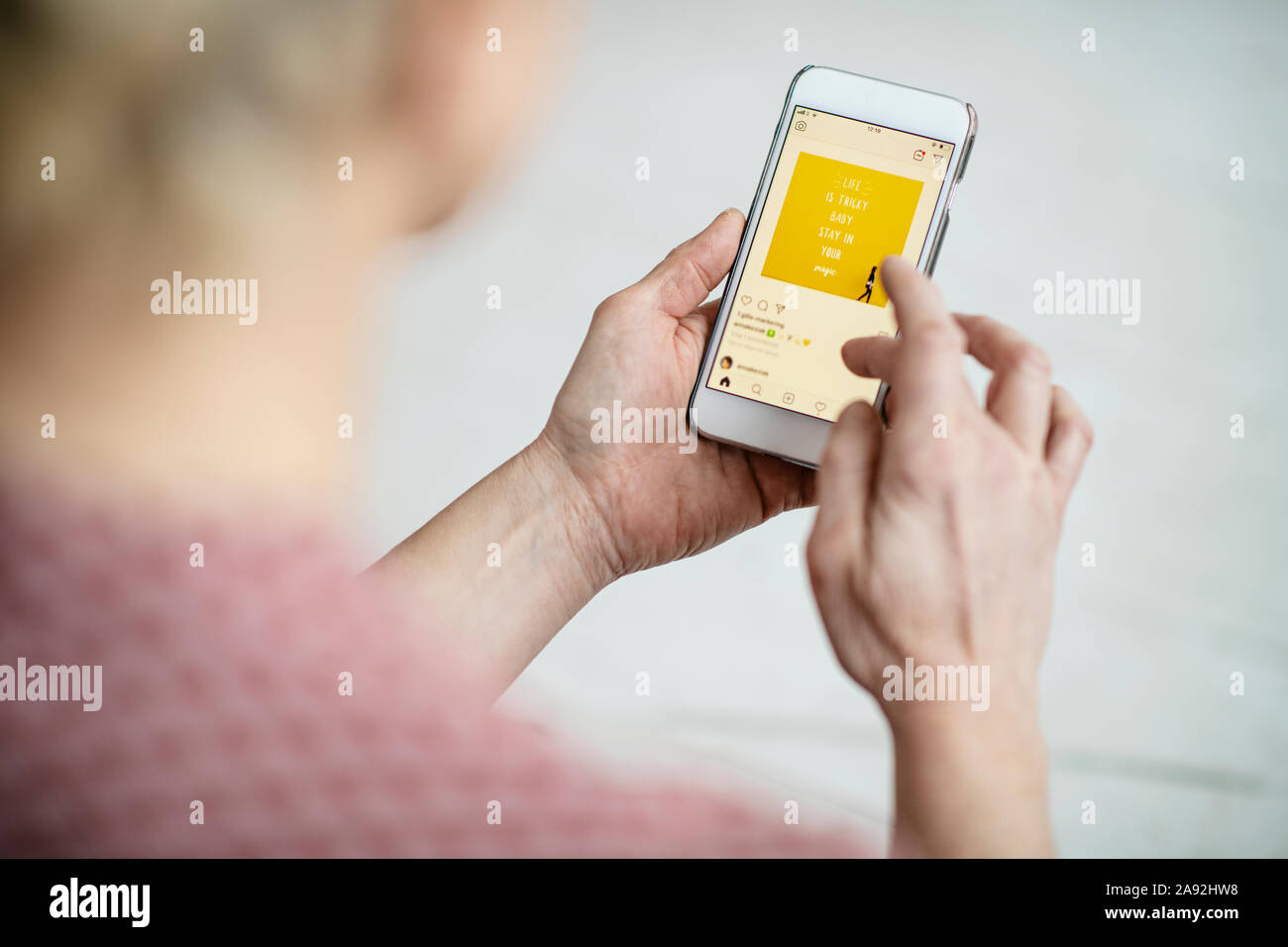 Woman using cell phone Stock Photo - Alamy