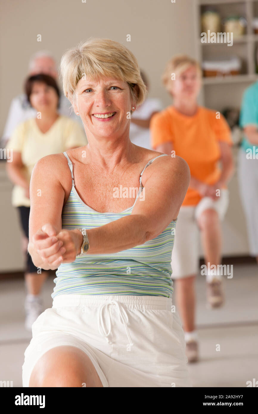 Senior exercise class doing stretches and cardio Stock Photo - Alamy