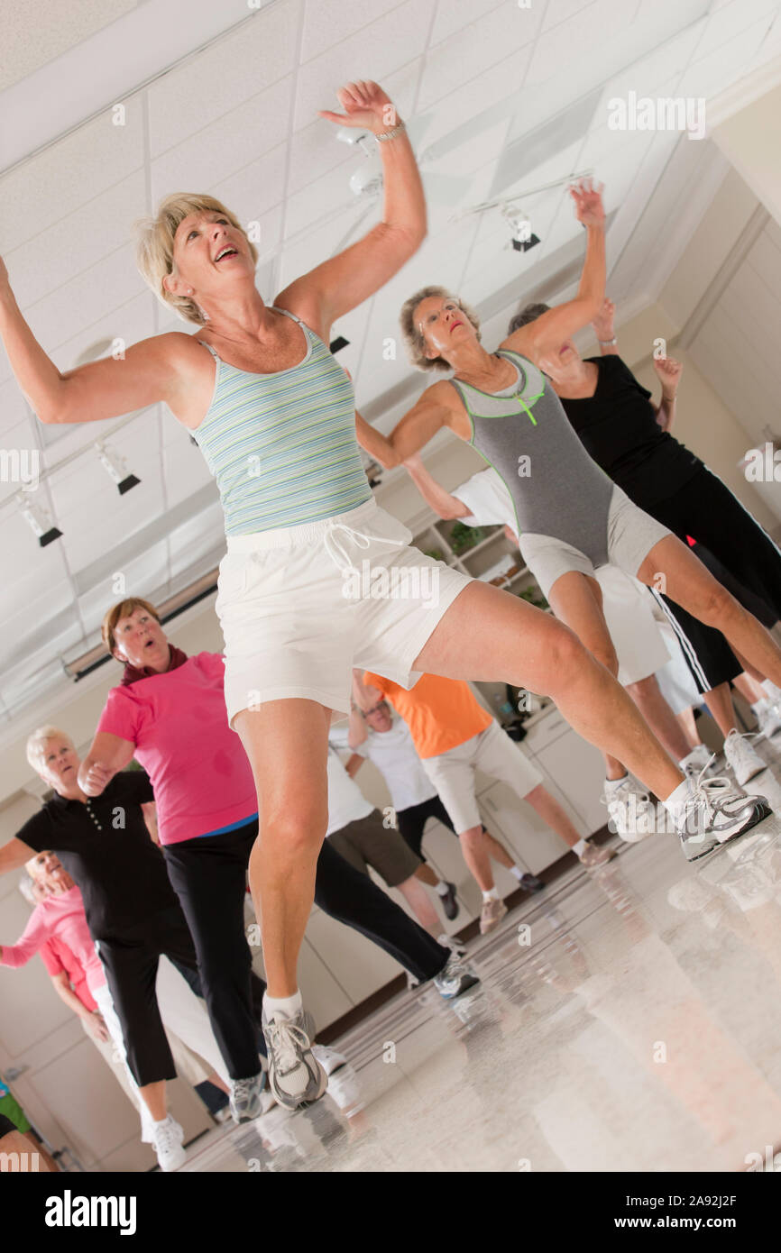 Senior exercise class doing stretches and cardio Stock Photo - Alamy