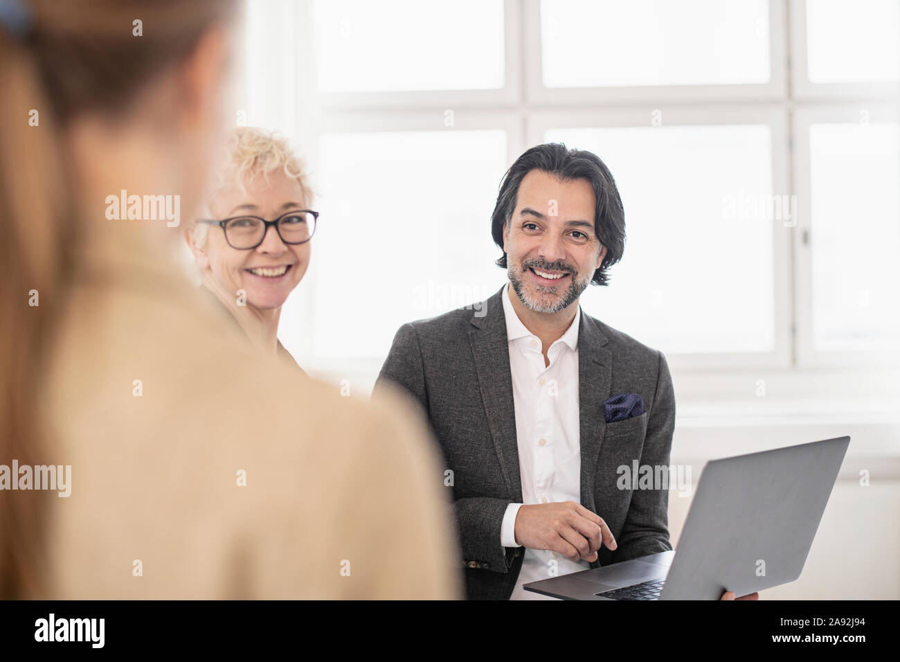 Business people smiling Stock Photo - Alamy