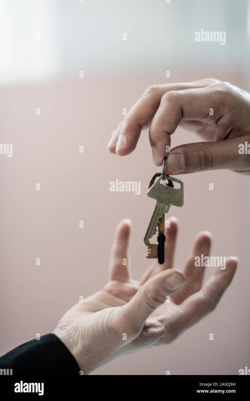 Hands with keys Stock Photo - Alamy