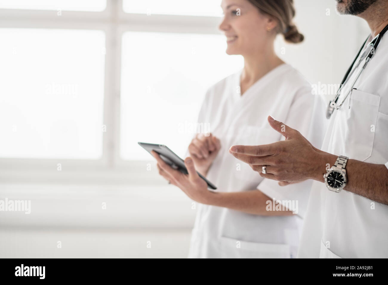 Doctors using digital tablet Stock Photo - Alamy