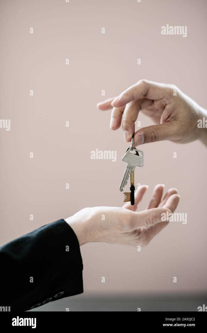 Hands with keys Stock Photo - Alamy