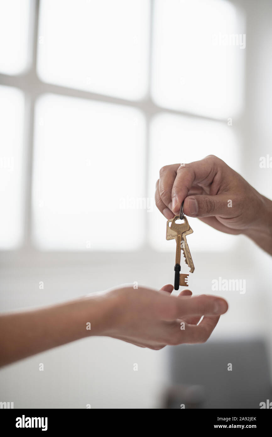 Hands with keys Stock Photo - Alamy