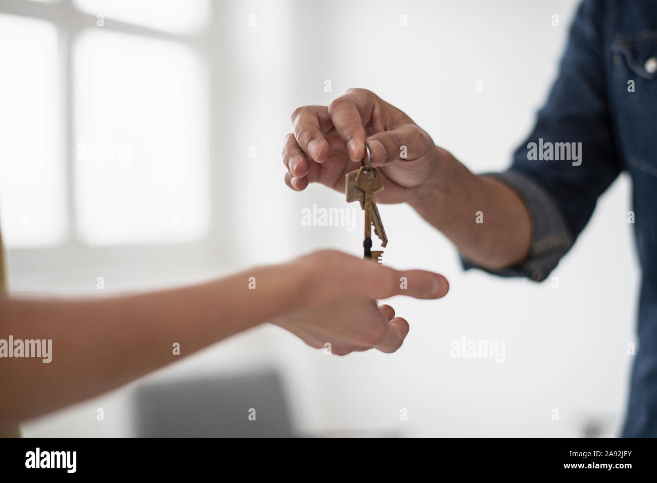 Hands with keys Stock Photo - Alamy