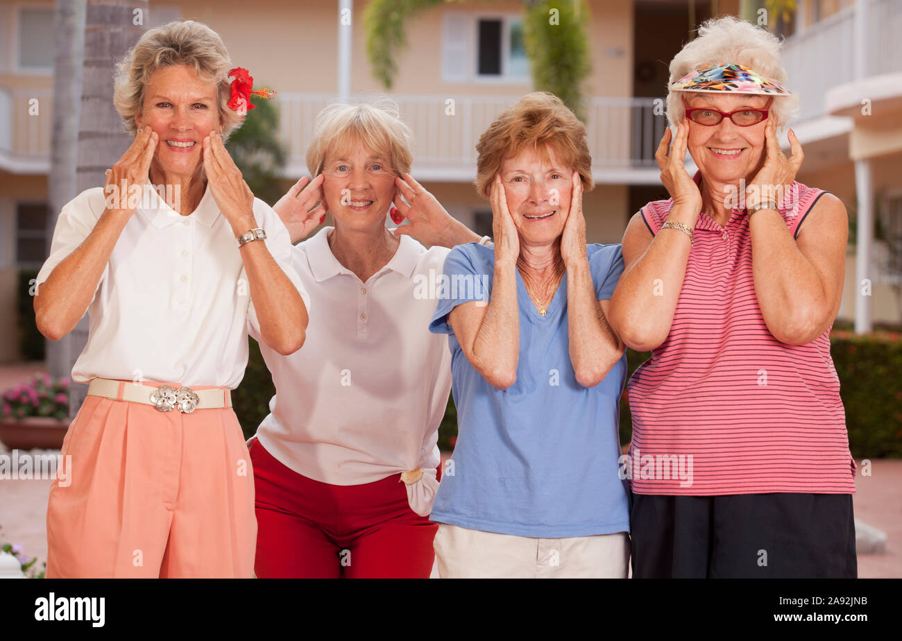 Portrait of four female friends wanting facelifts Stock Photo - Alamy