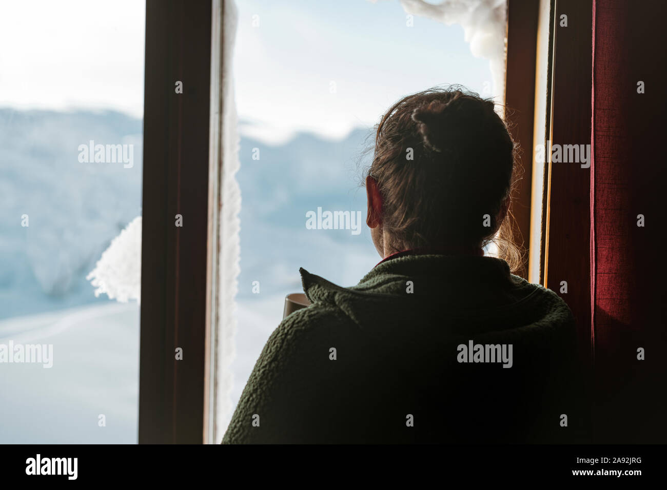 Man looking through window Stock Photo - Alamy