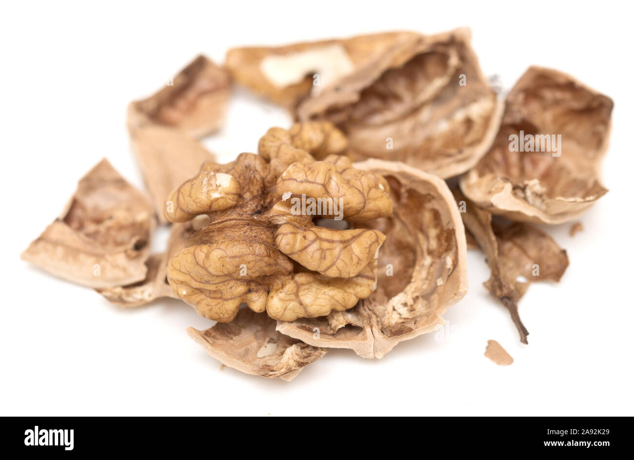 Crushed walnut isolated on white background Stock Photo - Alamy