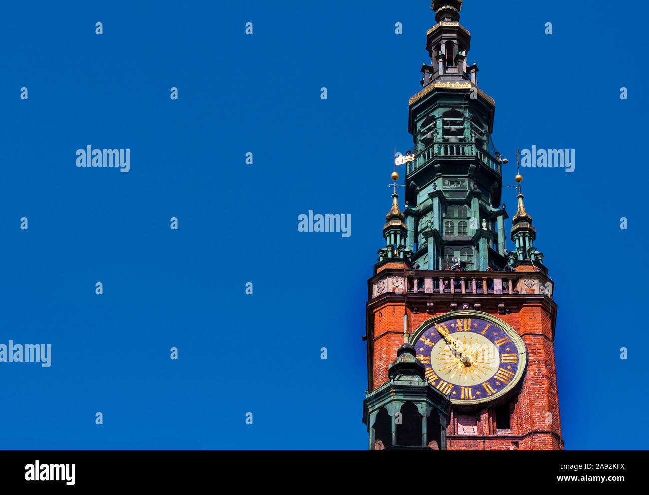 Clock tower of old historic brick town hall in Gdansk old town, Poland ...