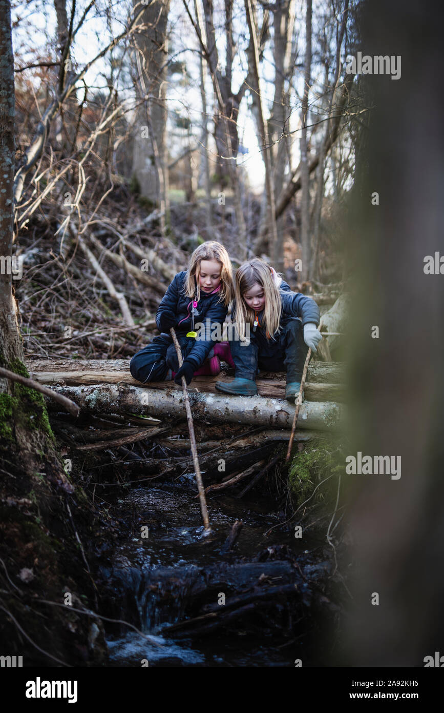 Girls at stream in forest Stock Photo - Alamy