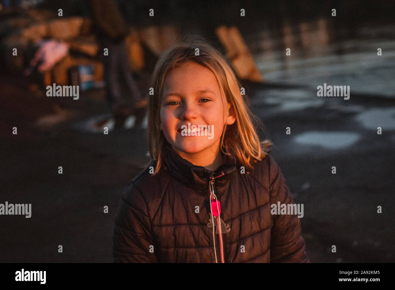 Smiling girl looking at camera Stock Photo - Alamy