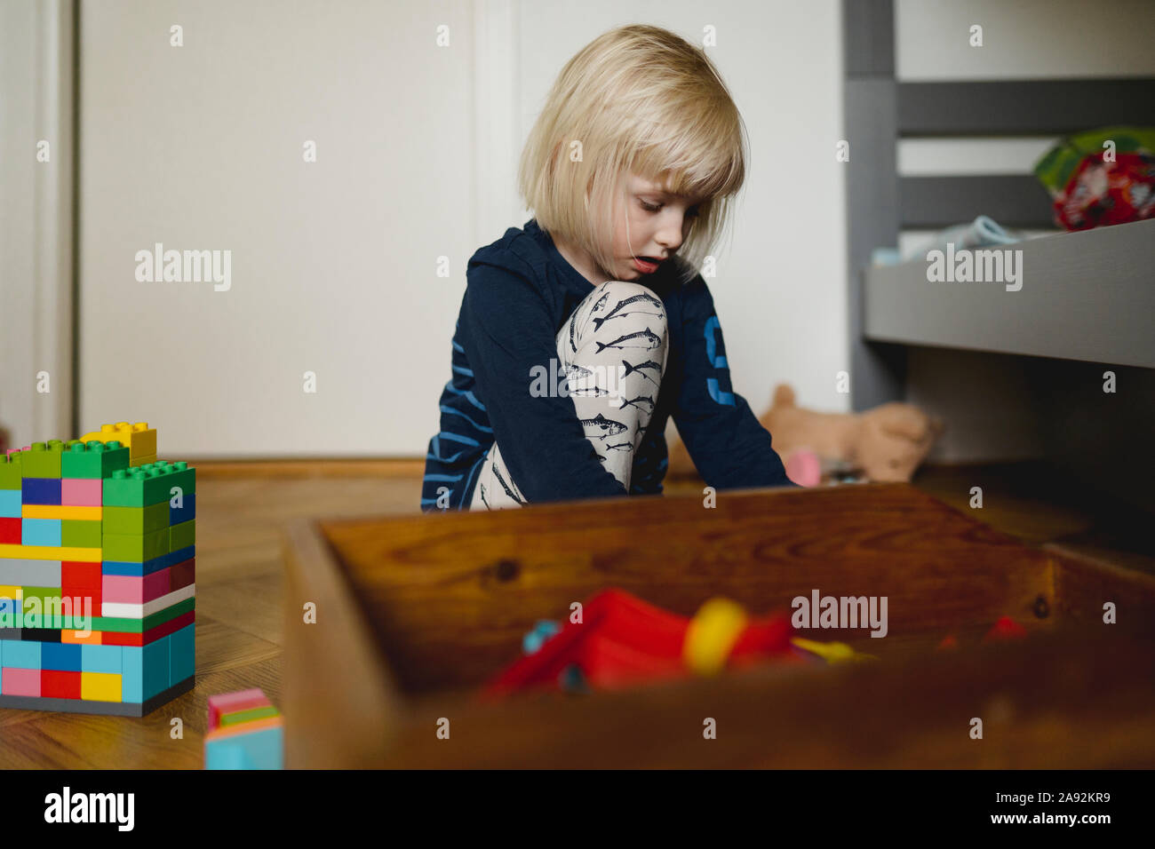 Girl playing building blocks Stock Photo - Alamy