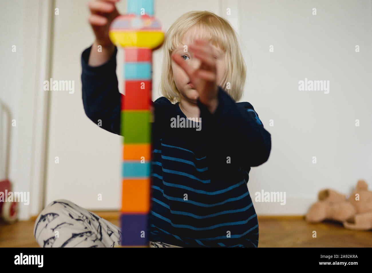 Girl playing building blocks Stock Photo - Alamy