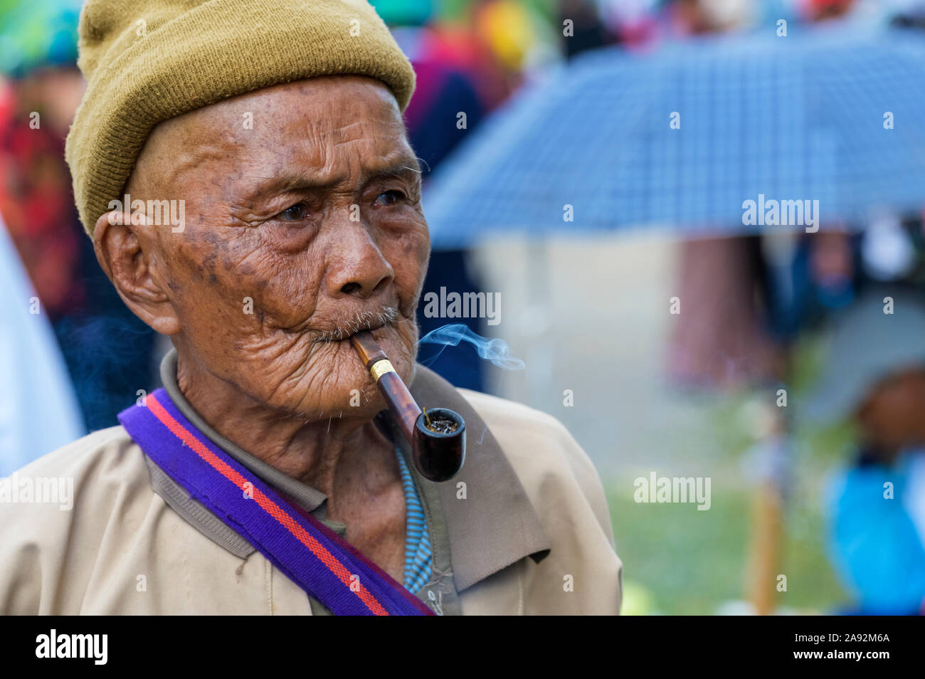 Burmese senior man smoking a pipe; Yawngshwe, Shan State, Myanmar Stock ...