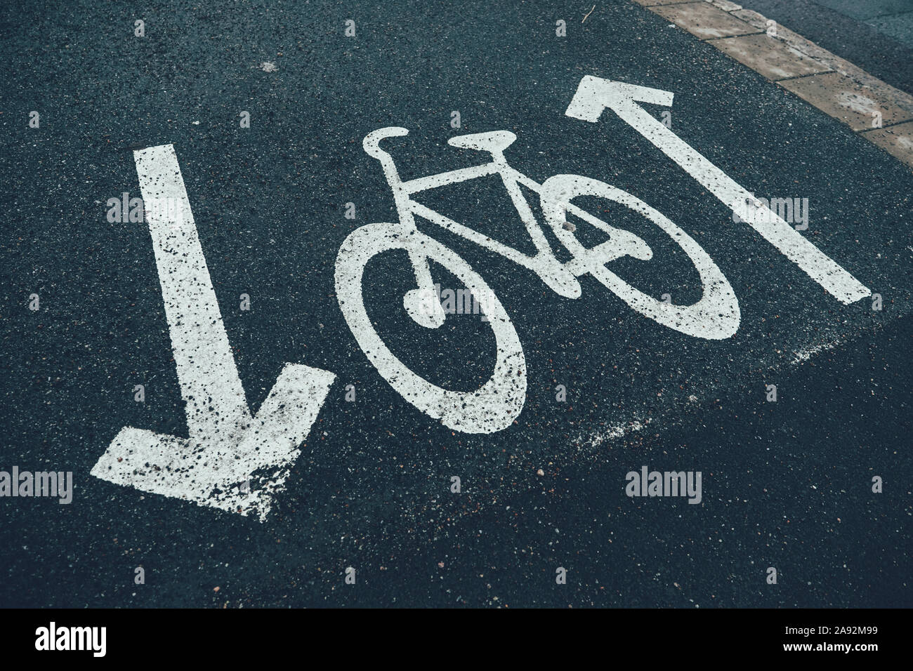Bicycle road sign painted on street Stock Photo - Alamy